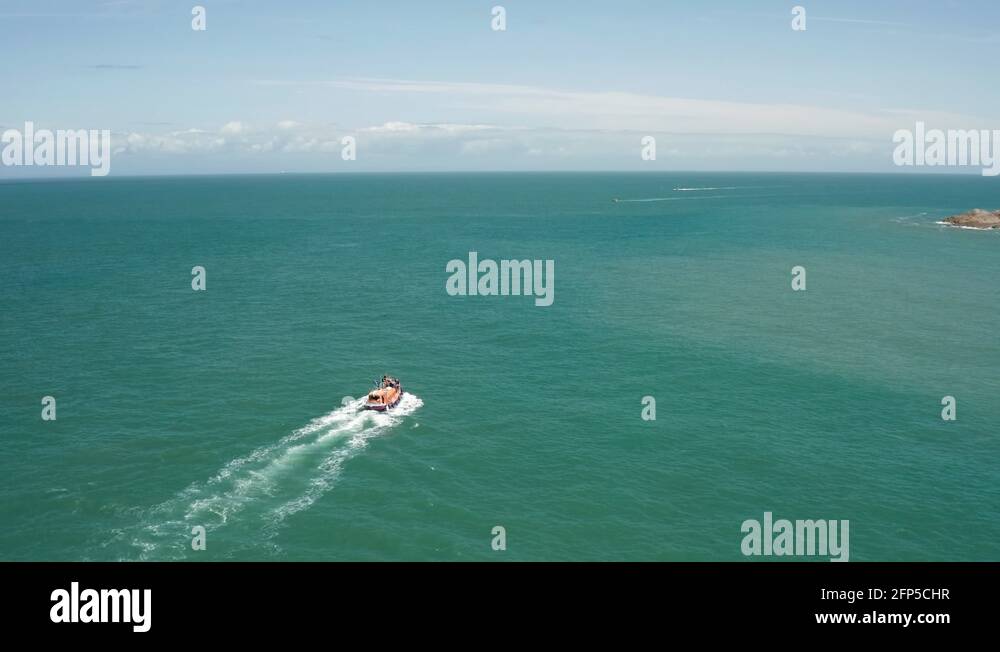 Aerial Flypast of a Mersey Class RNLI Lifeboat Patrolling British ...