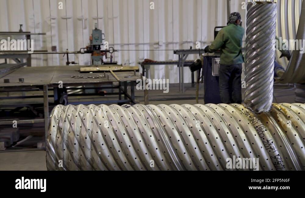 Cameraes right showing large corrugated metal pipe junction with holes ...