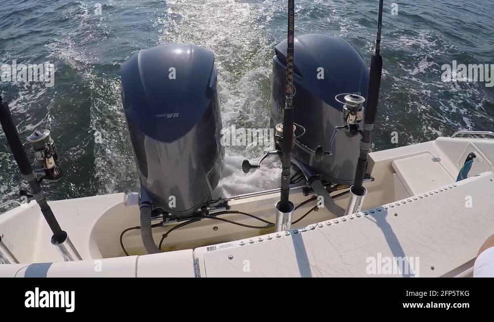 Dual motor engine system propels speed boat forward, creating a wake ...