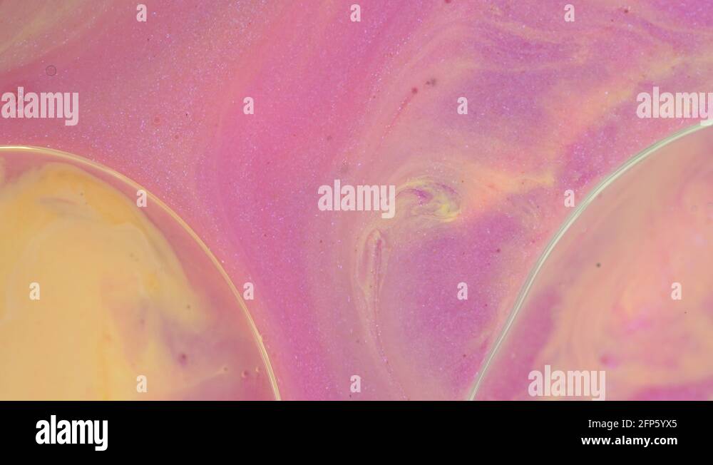 Pale yellow, pink pastel liquid paint colors mix. Fluid gradient ...