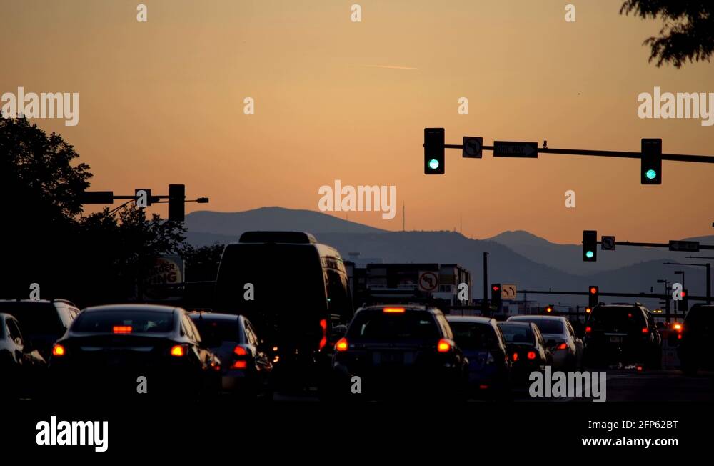 Cars passing through an intersection Stock Video Footage - Alamy