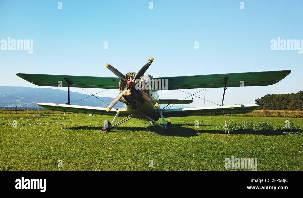 Russian Antonov An-2 on grass airfield, vintage Soviet propeller ...