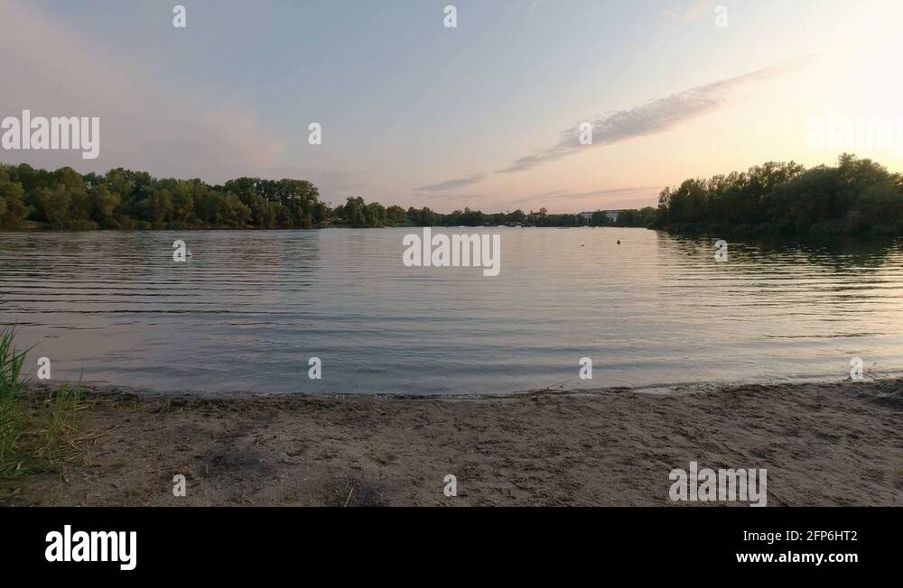 Frontal view of water with ripples at lake during sunset, Rheinau ...