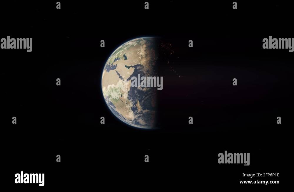 Planet Earth in shadow rotating closer revealing daylight Africa Stock ...