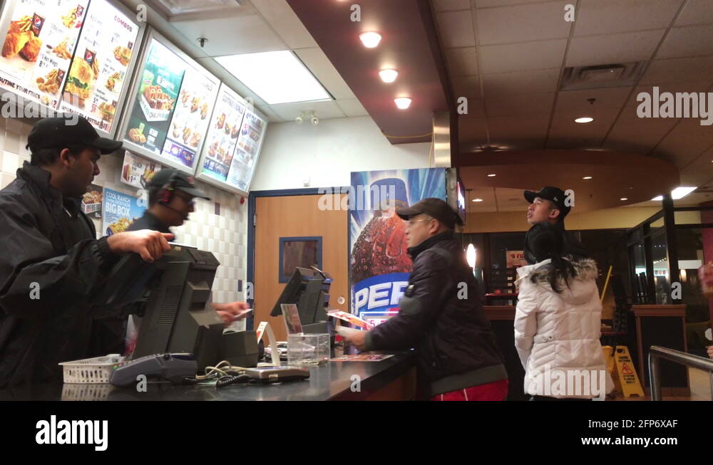 Motion of people paying credit card for ordering food inside KFC ...