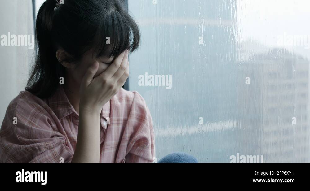woman cry near by window Stock Video Footage - Alamy