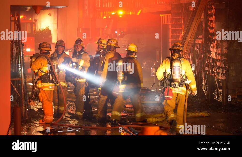 Inspecting a fire Stock Videos & Footage - HD and 4K Video Clips - Alamy