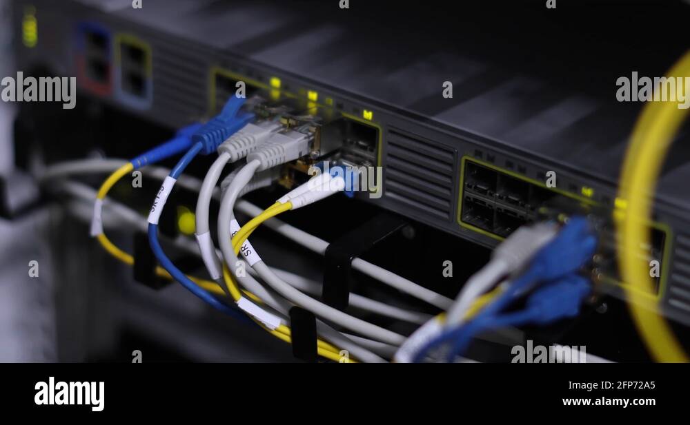 Switch And Optic Cable Connected To Network Panel With Blinking Leds ...