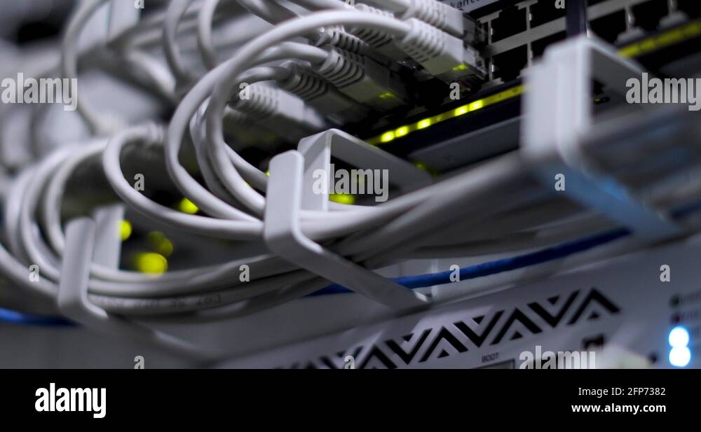 Switch And Optic Cable Connected To Network Panel With Blinking Leds ...