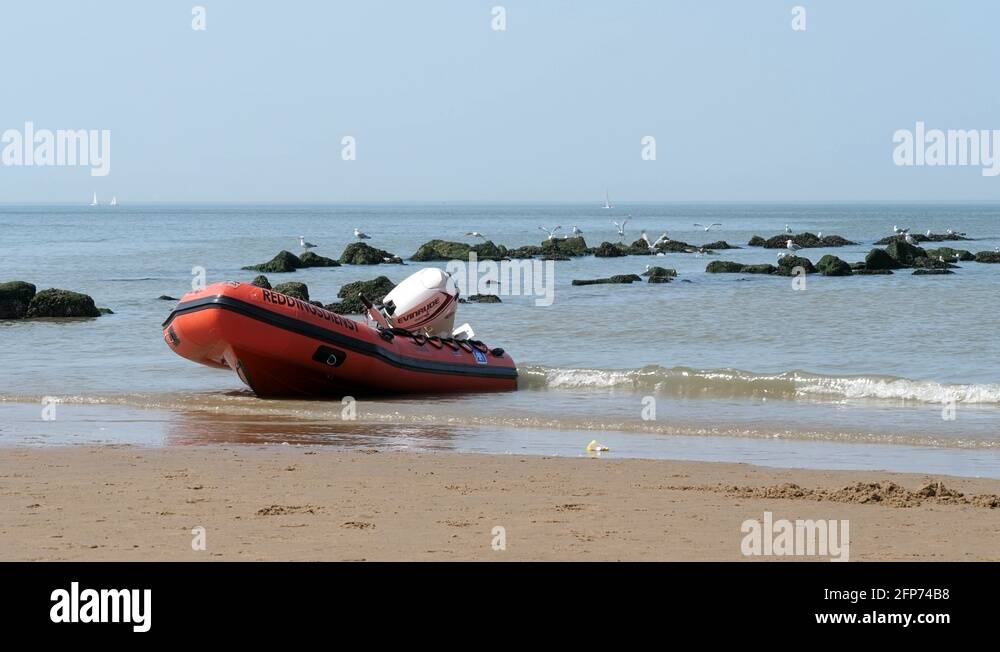 Inflatable rescue boat docked at the beach. Static. Slowmo Stock Video ...