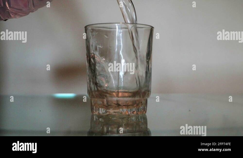 Pouring water into a glass. Water enters the glass. Every glass of ...