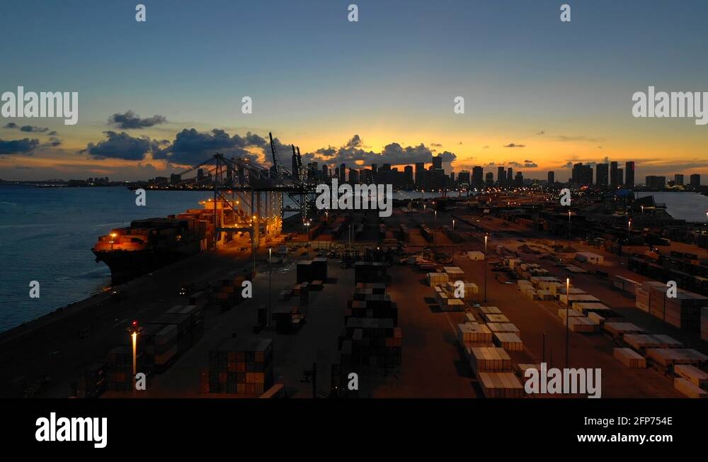 Sunset aerials over Port Miami 4k cranes and cargo with view of ...