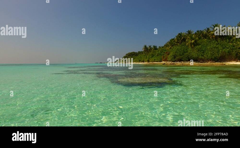 Tropical rainforest and emerald green waters of Pacific ocean coast in ...