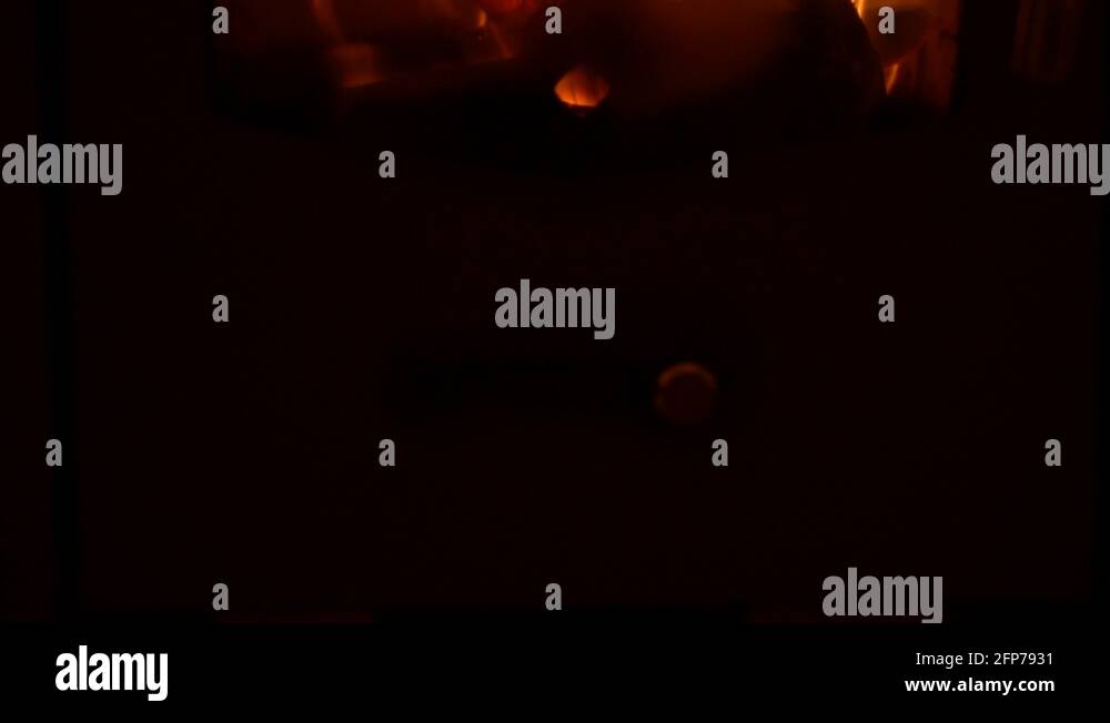 Fire burning in wood burner, camera tilt reveal slow motion Stock Video ...