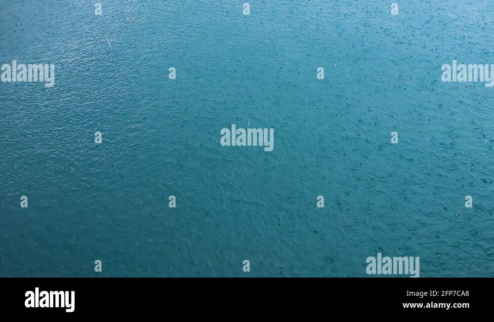 Rain Drops Falling into the Ocean. Seamless Loop Copy Space Stock Video ...