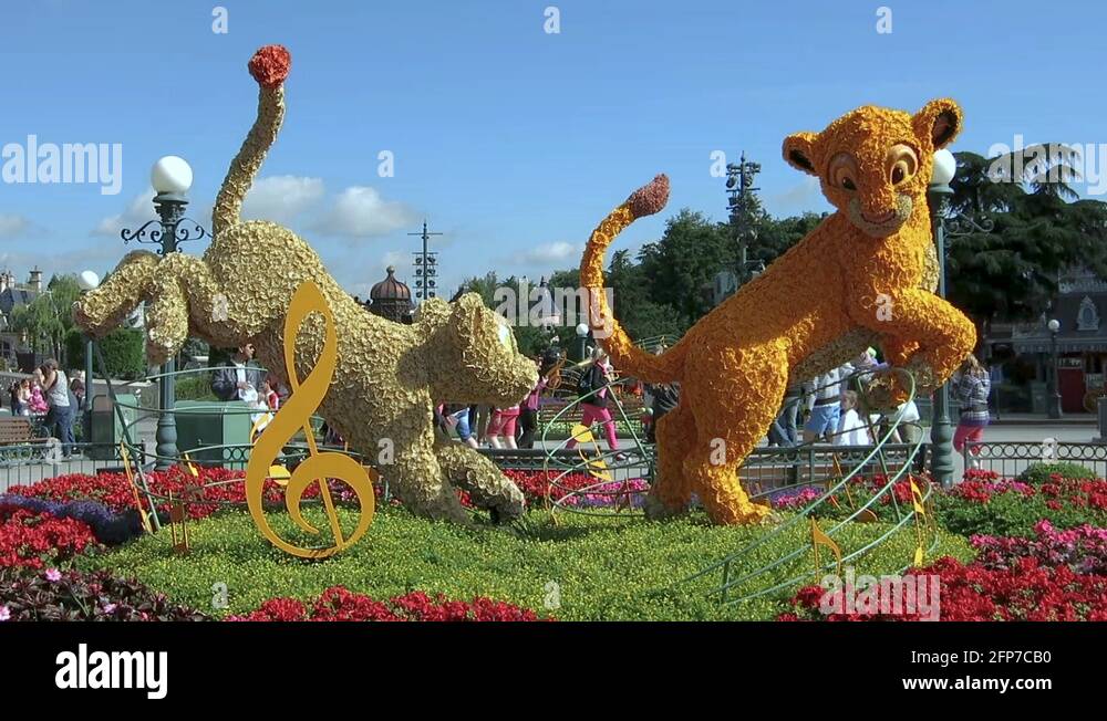 Disneyland Paris Park Simba Flower Statue, medium shot with people ...