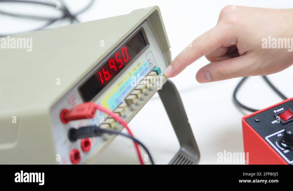 Engineering Student Using a Digital Multimeter for a Classroom ...