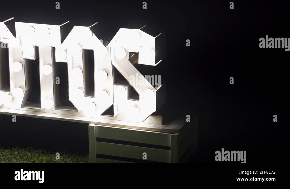 Illuminated lit bulb marquee highlight photos booth word sign board in ...