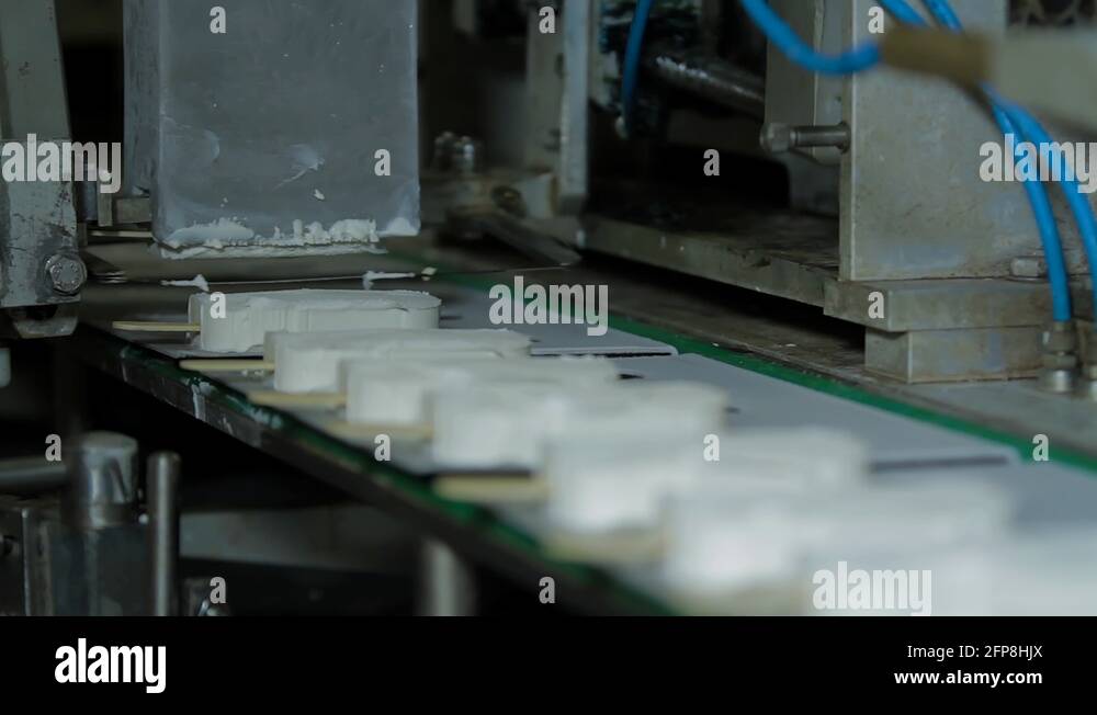 Ice cream production line. Desserts on conveyor belt. Food production ...