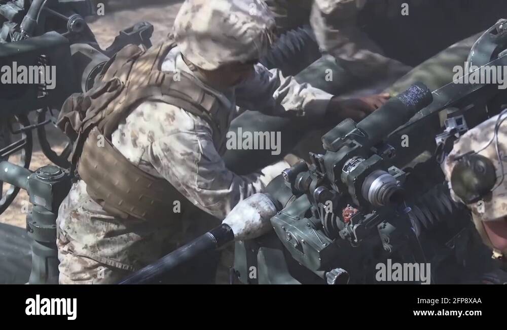 US Marine Corps artillery battalion. M777 howitzer Shot. Soldiers ...