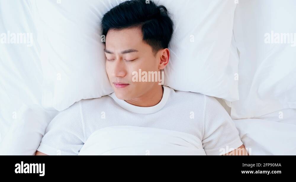 man sleeping well in bed Stock Video Footage - Alamy