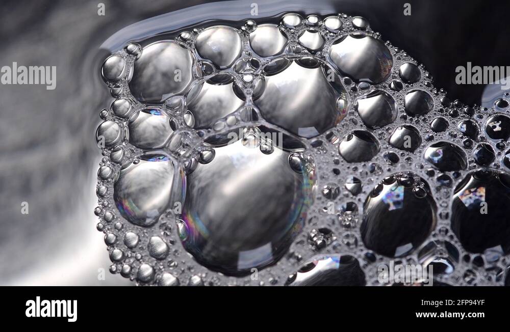 Bubbles on the surface of water inside a metallic container Stock Video ...