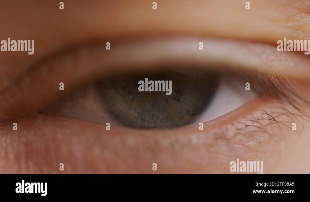 macro shot of the human eye. Opening the eye in the slow motion Stock ...