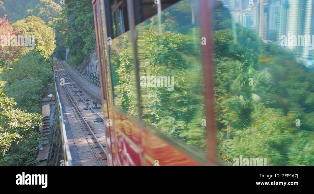 The Peak Tram funicular cable-car railway going down the track, Hong ...