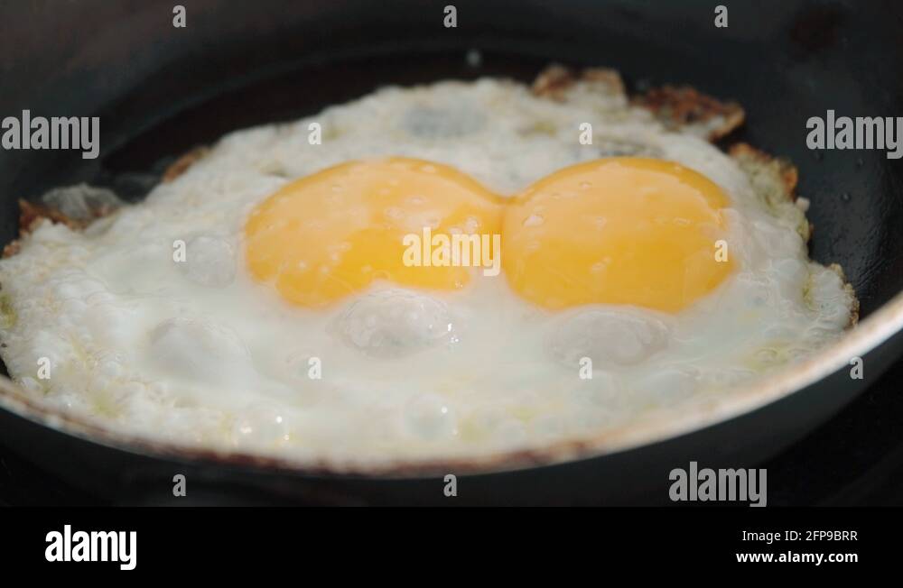 Egg yolks frying pan Stock Videos & Footage - HD and 4K Video Clips - Alamy