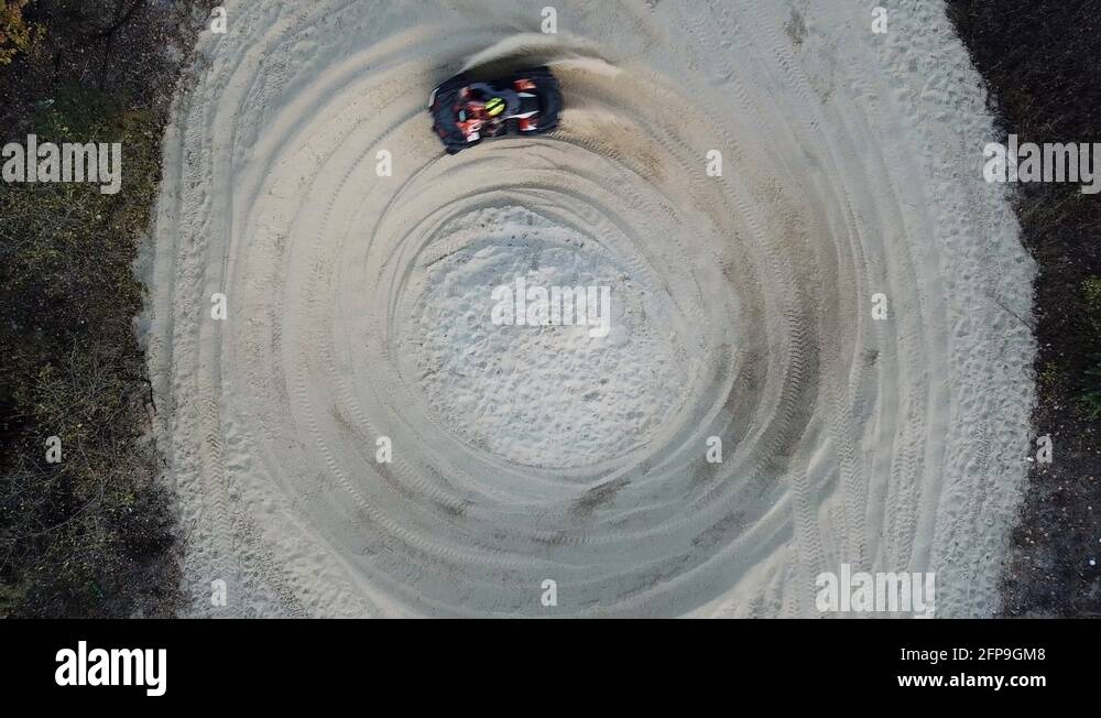Birds Eye Aerial View of Quad ATV Vehicle Counterclockwise Spinning ...