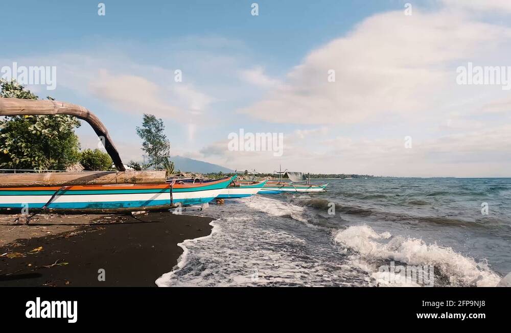 Traditional fishing boats by the Palale Beach in Albay, Philippines ...