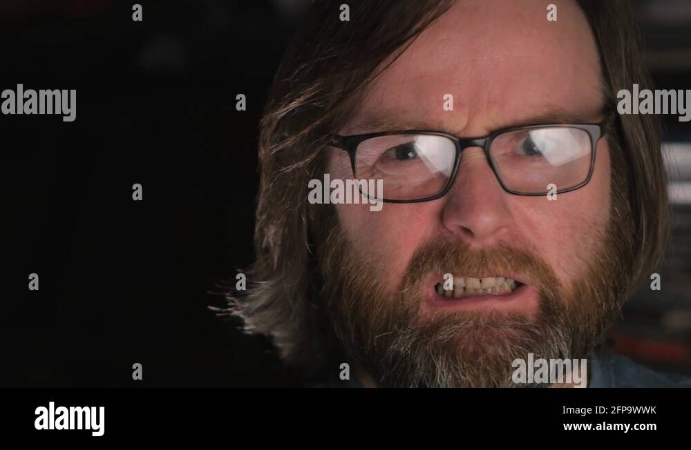 Face of Angry Man with Teary Eyes Gritting His Teeth In Rage, Close Up ...