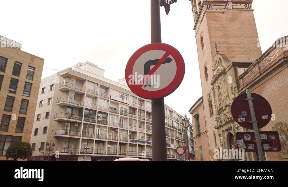No Right Turn sign by church tower with grey rainy sky, Moving Closer ...