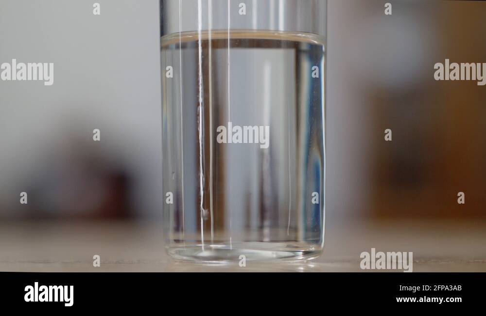 Effervescent vitamin C or antacid tablet bubbles and dissolving in ...