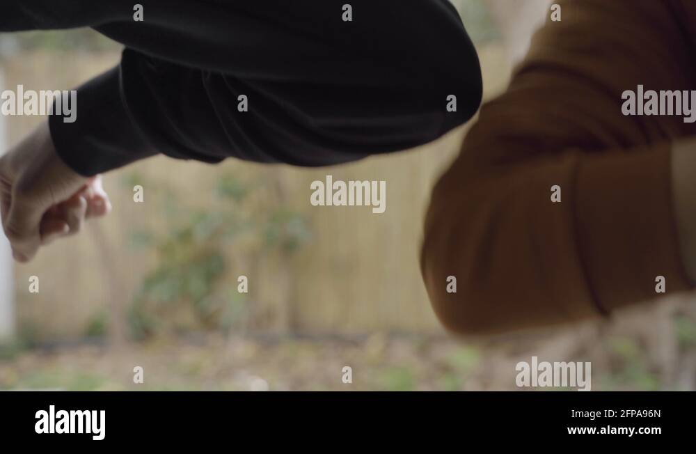 Elbow handshake Stock Videos & Footage - HD and 4K Video Clips - Alamy