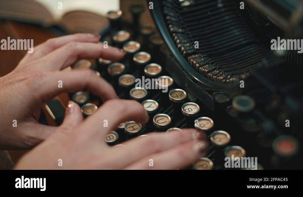 slow motion typing on a vintage Underwood typewriter. Woman types Stock ...