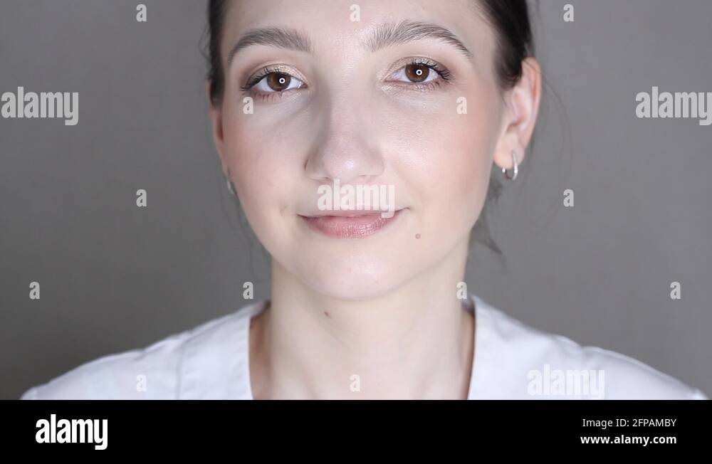 Woman putting on medical face mask for virus infection prevention and ...