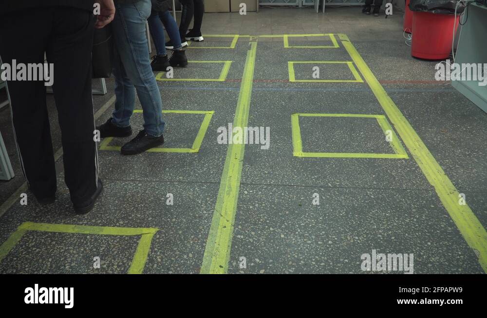 The markings on the floor to maintain social distance between people ...
