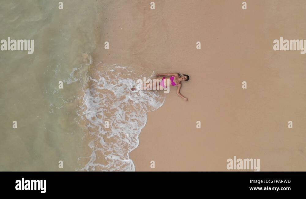 girl laying down on a beautiful beach in sri lanka Stock Video Footage ...