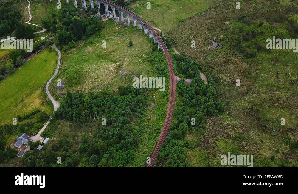 Glenfinnan Viaduct railway train arch bridge in Scotland, aerial birds ...