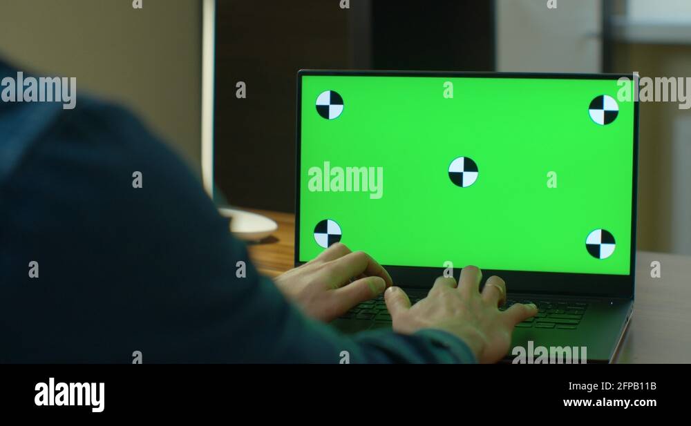 Male Video Editor Works on His Personal Computer with Green Screen Mock ...