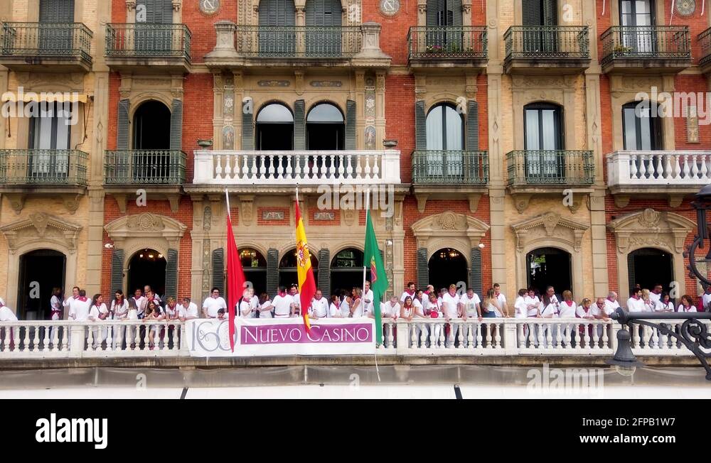 people palavering at a balcony of building in the main square during ...