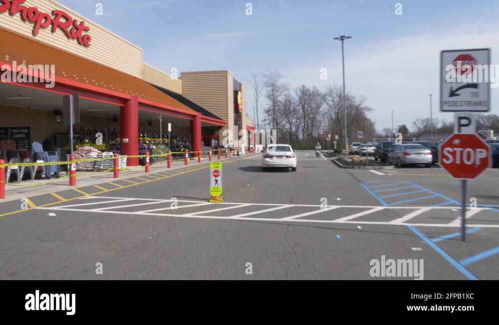 4K: Driving by a grocery store with caution tape and warning signs for ...