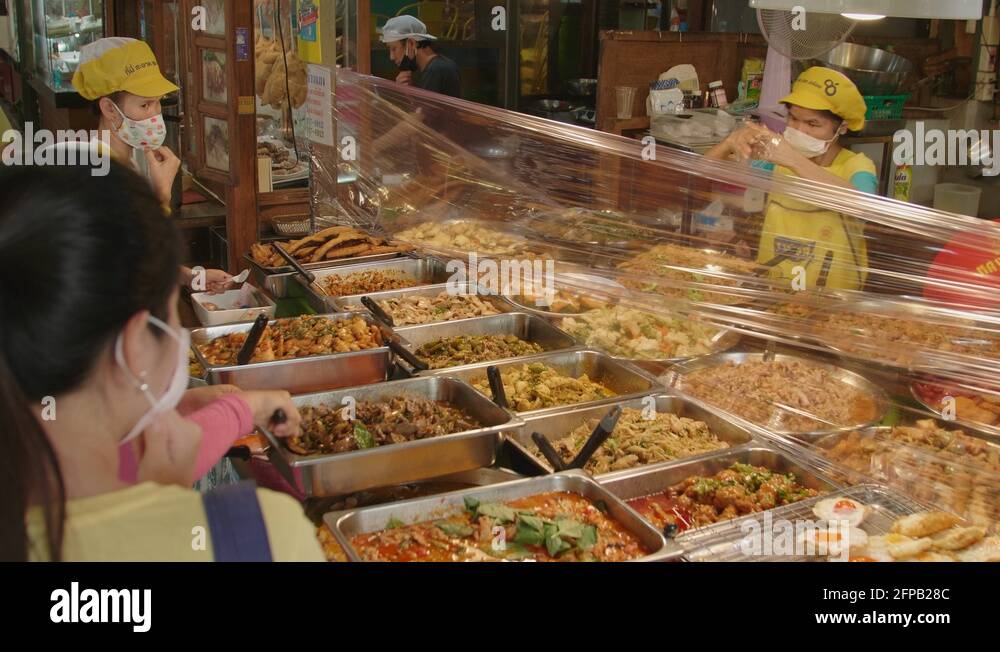A local food stall at a community market in Bangkok still operate as ...
