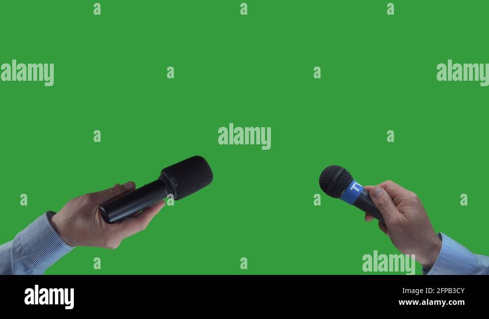 Two reporter holding mic, waiting for interview,green screen background ...