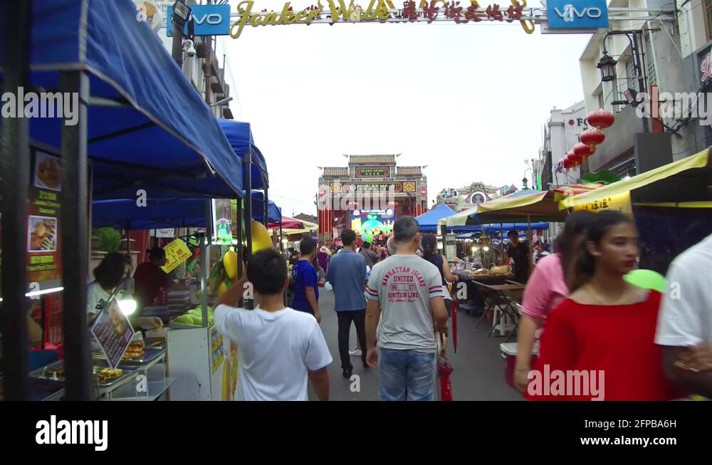 crowd of people walking in the middle between the stalls Stock Video ...