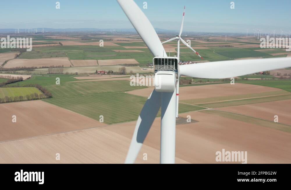 Rotating wings of wind power plant producing renewable green clean ...