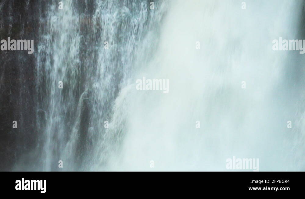 Powerful waterfall, force of nature, water falling down into a gorge ...
