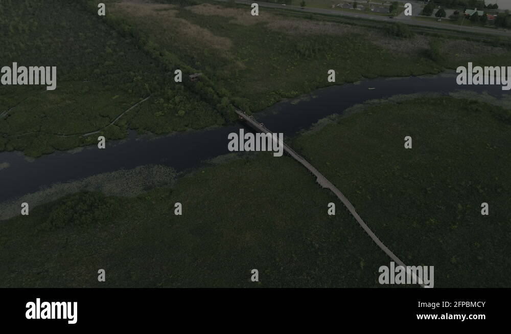 Wooden Pathway And Bridge Over The Riviere aux Cerises In Magog, Quebec ...