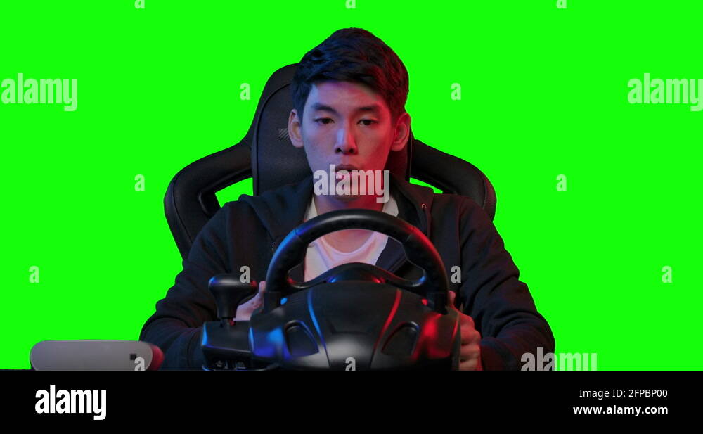 POV gamer playing in car racing game over green screen background Stock ...